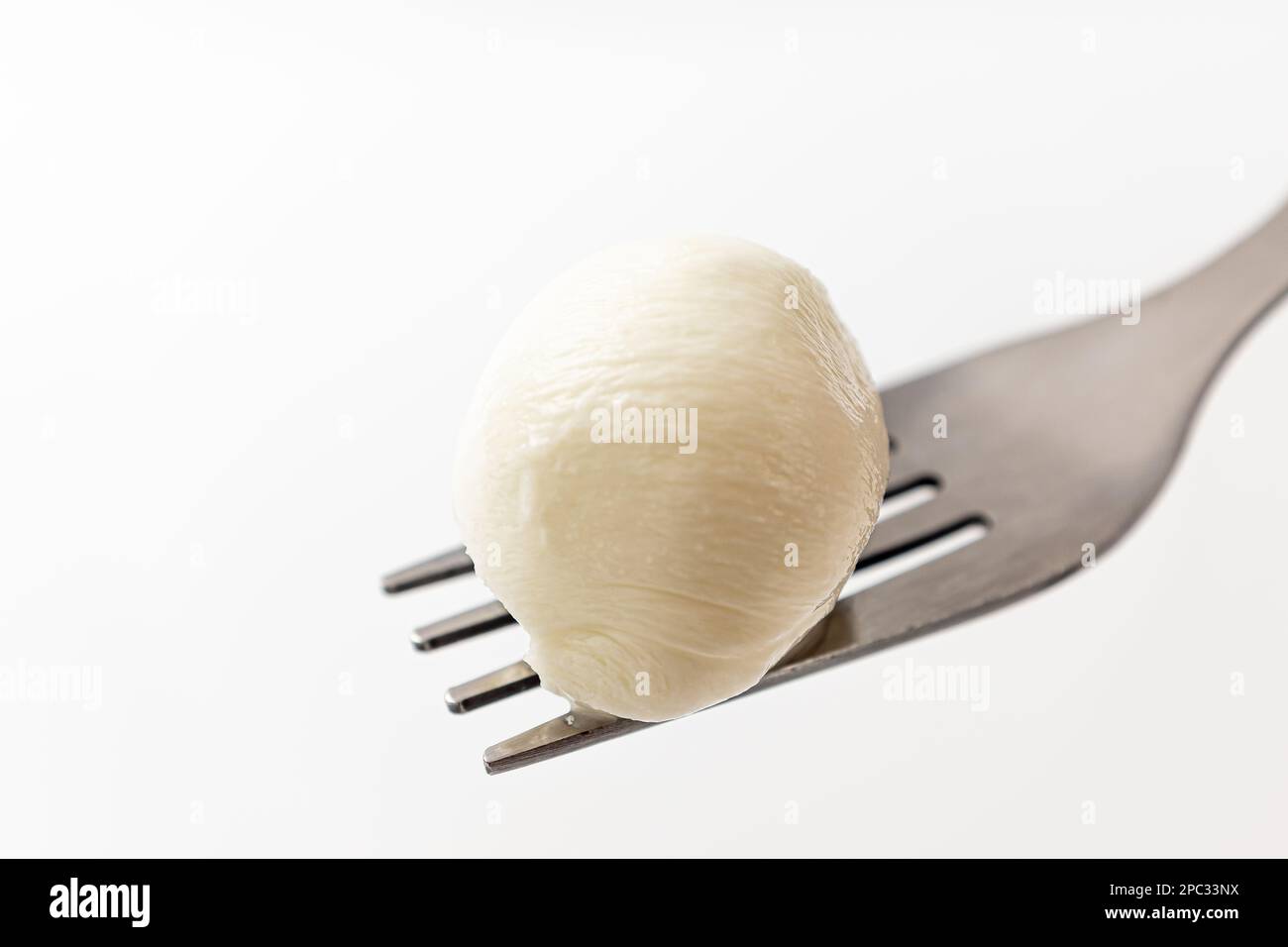 Mozzarella pearls cheese on white background Stock Photo - Alamy