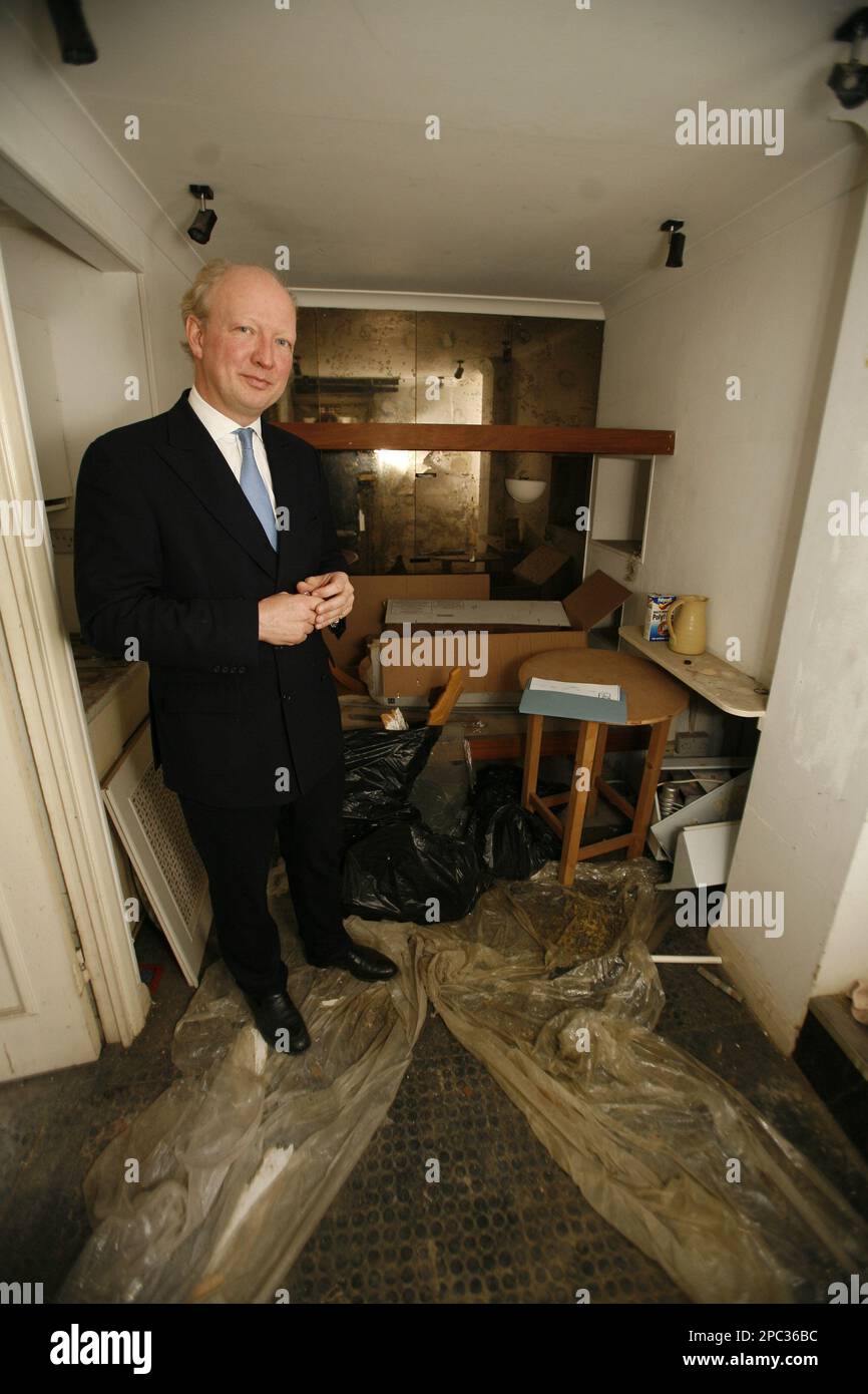 Real estate agent Andrew Scott poses for the photographers inside an ...