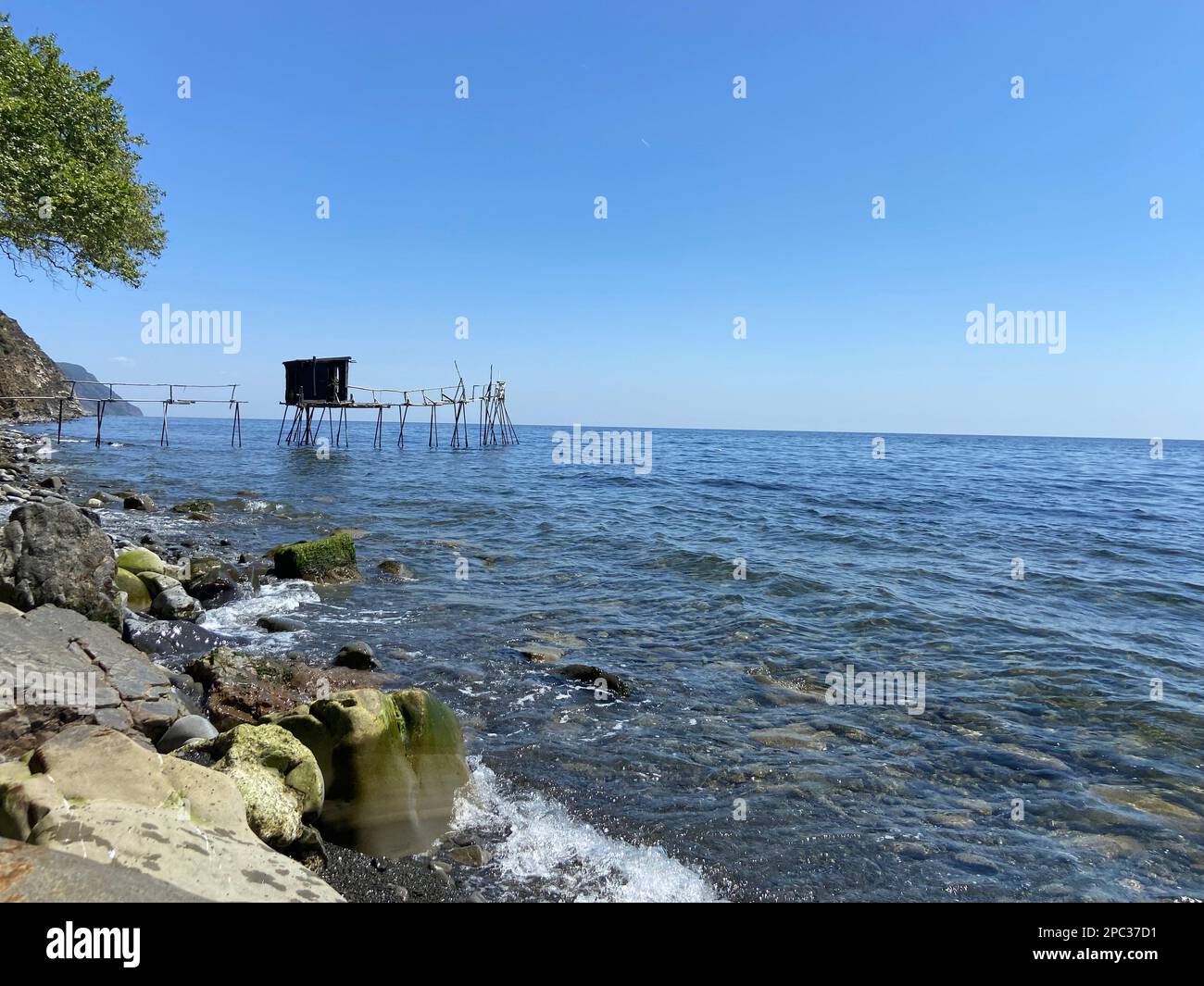 Wooden abandoned stilt tower house fisherman cave on diy pier on the ...