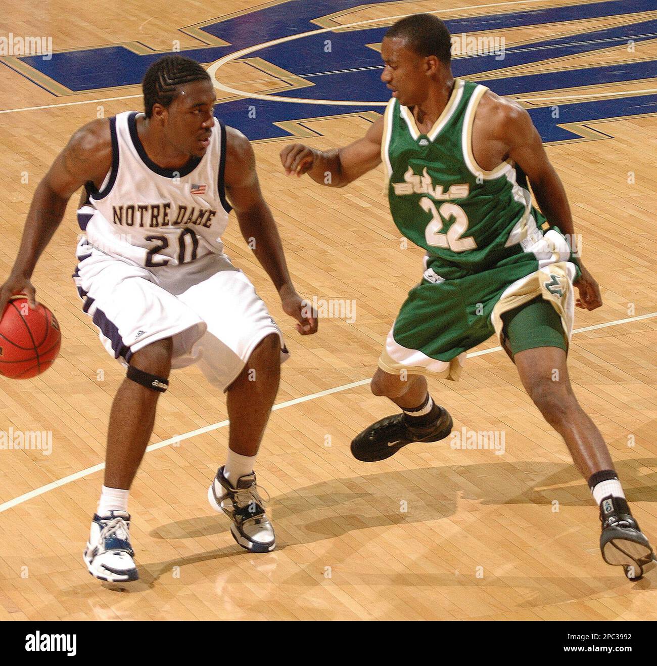Notre Dame guard Jonathan Peoples, left, attempts to drive up court ...
