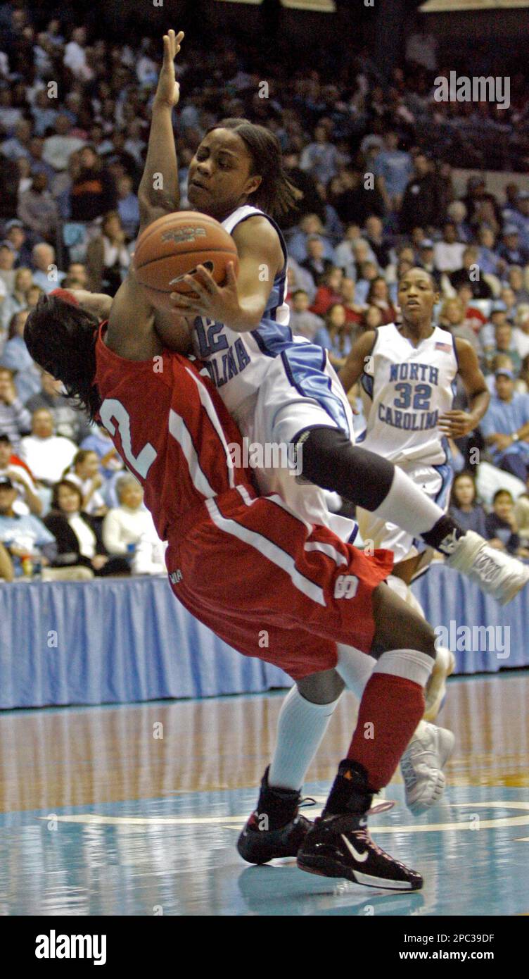 North Carolina's Ivory Latta, right, drives to the basket as North ...