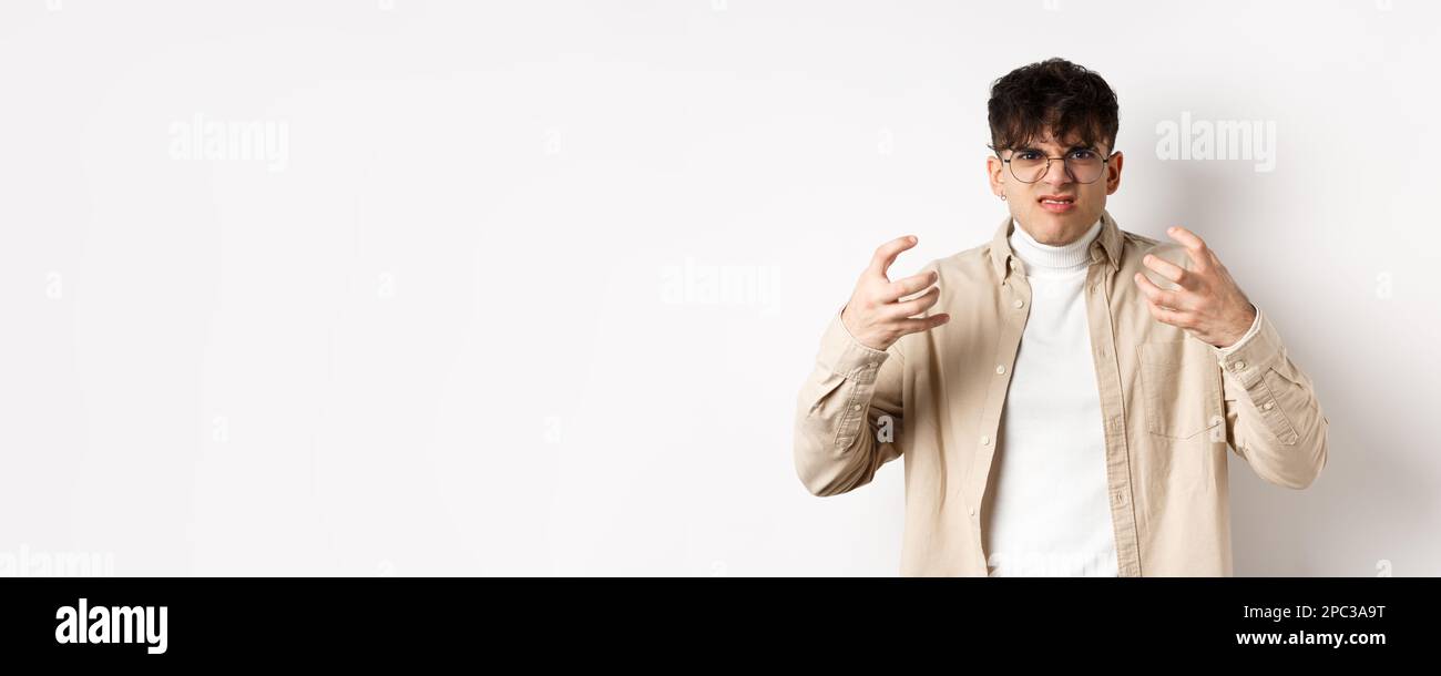 Portrait of annoyed and mad guy wants to strangle someone, grimacing ...