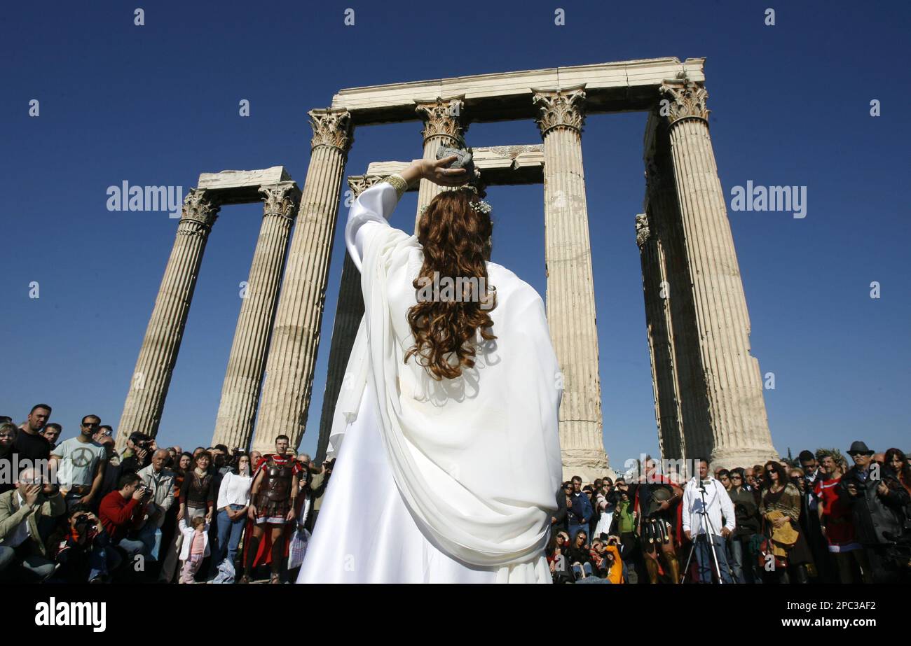 A female priestess participates in a rare ceremony honoring Zeus, the ...