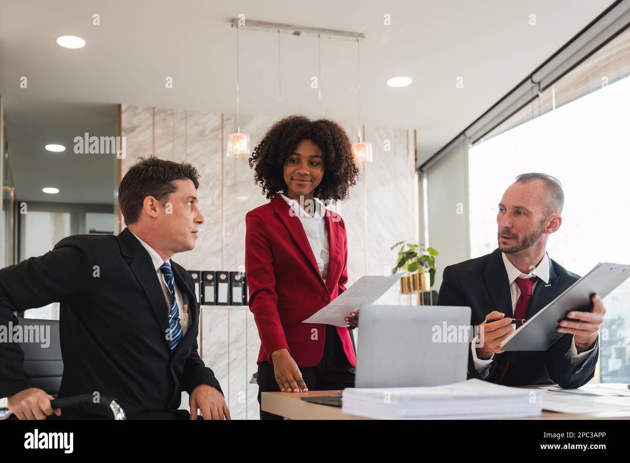 Diverse business team discussing project at corporate briefing in ...