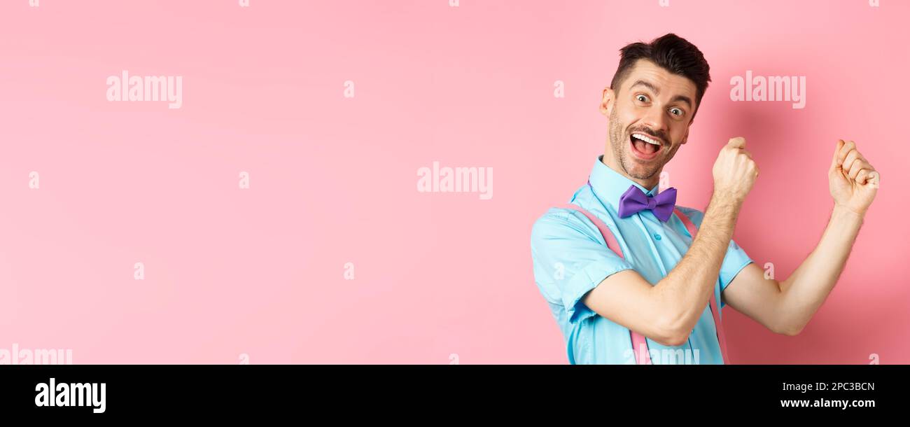 Image of cheerful man celebrating holiday, dancing and having fun ...