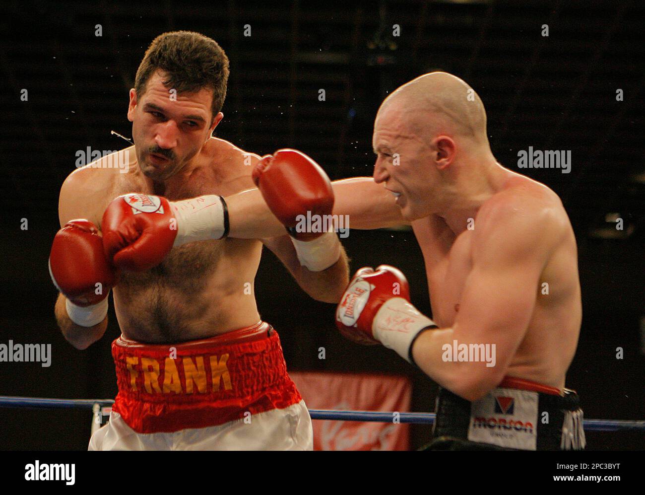 Matthew Hatton, right, of England, lands a right to the face of Frank ...