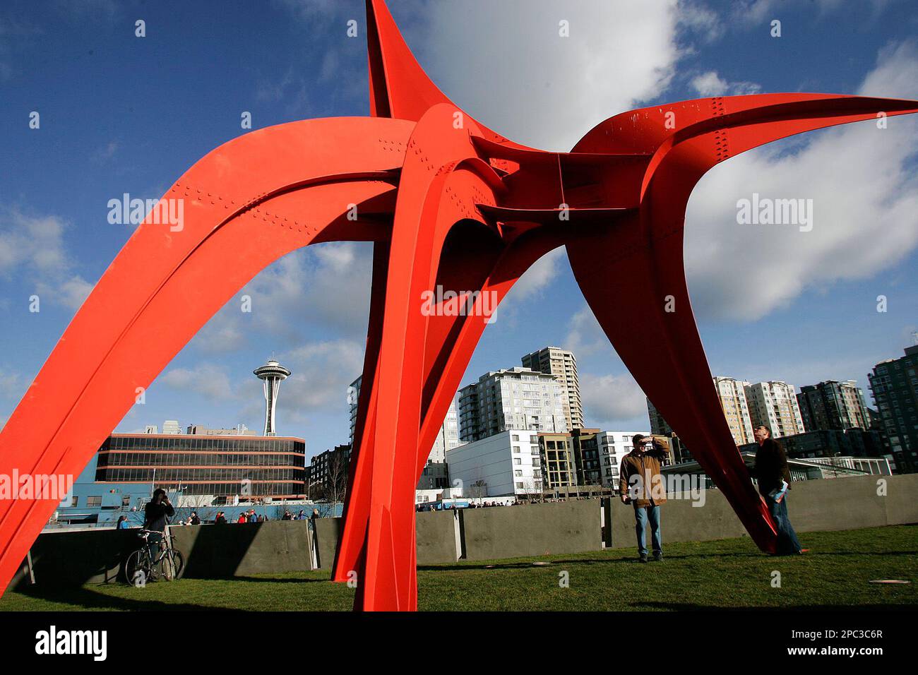 Visitors to the new Olympic Sculpture park examine the "Eagle," a ...