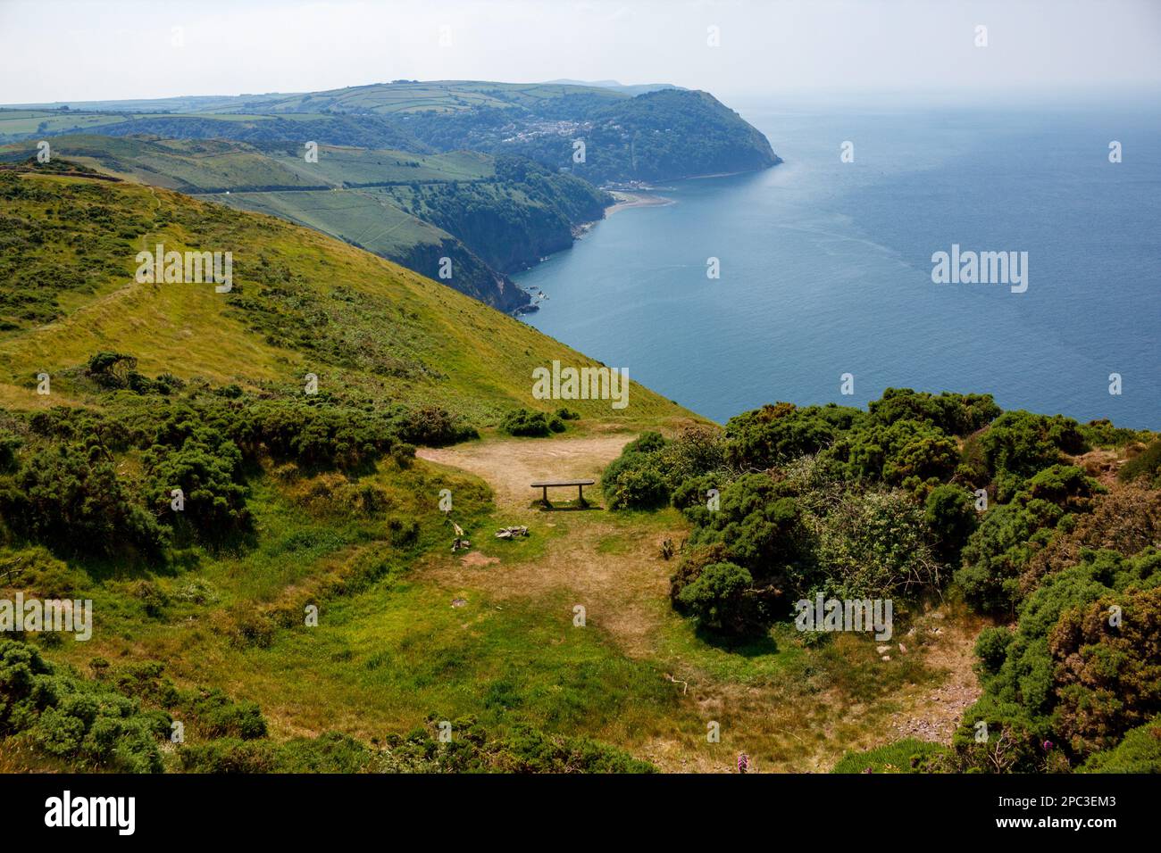 View of North Devon coastline with seat in the distance, UK Stock Photo ...