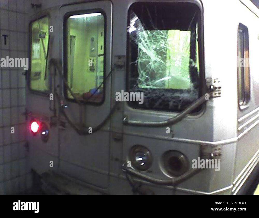 A photo taken with a cell phone shows a subway train standing at rest ...