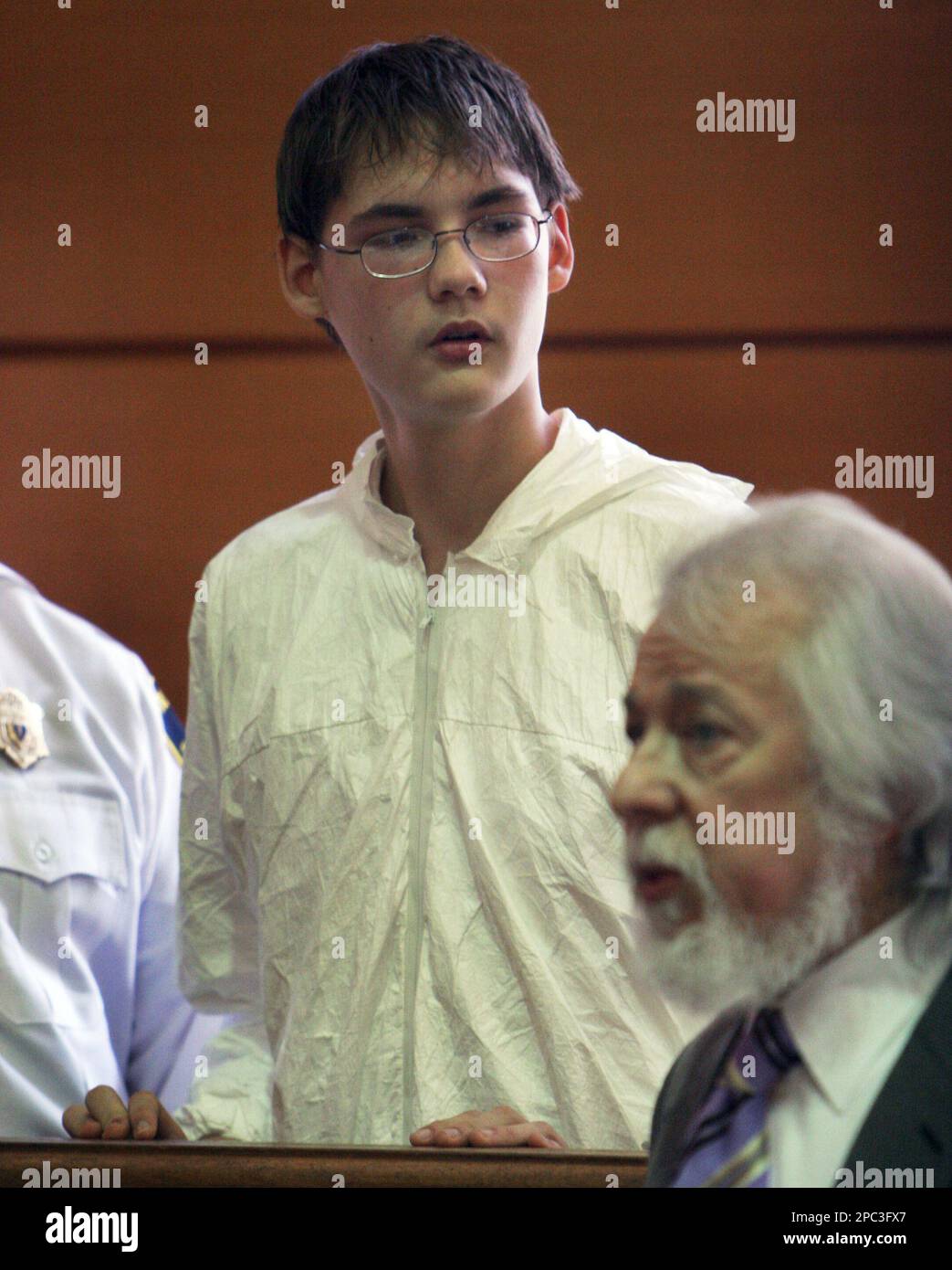 John Odgren, 16, of Princeton, Mass., looks toward his parents as he is ...