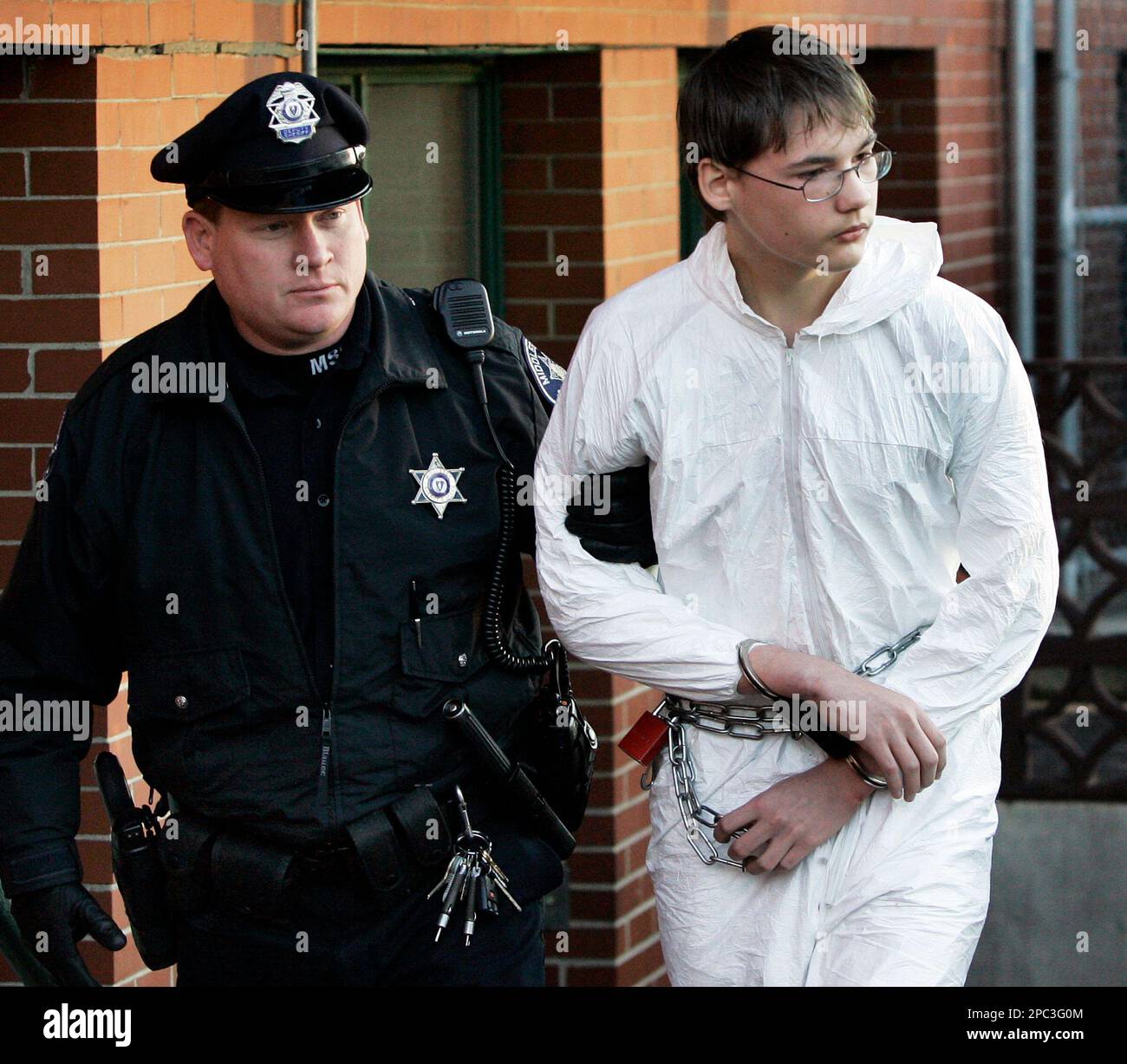 John Odgren, 16, of Princeton, Mass., is led from District Court in ...