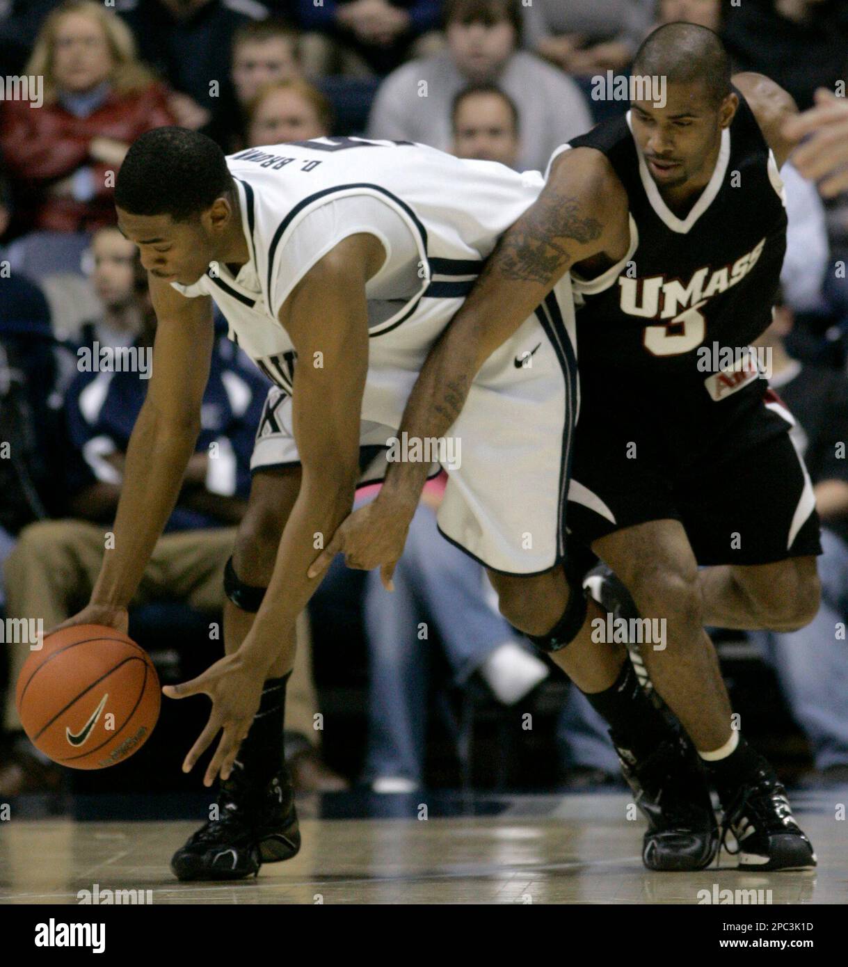 Xavier forward Derrick Brown, left, steals the ball from Massachusetts ...