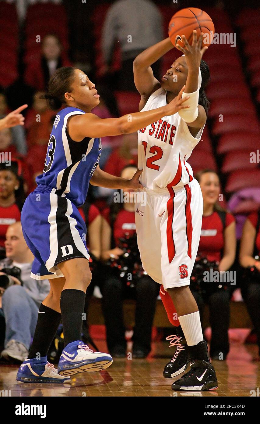 North Carolina State's Marquetta Dickens, right, tries to pass the ball ...