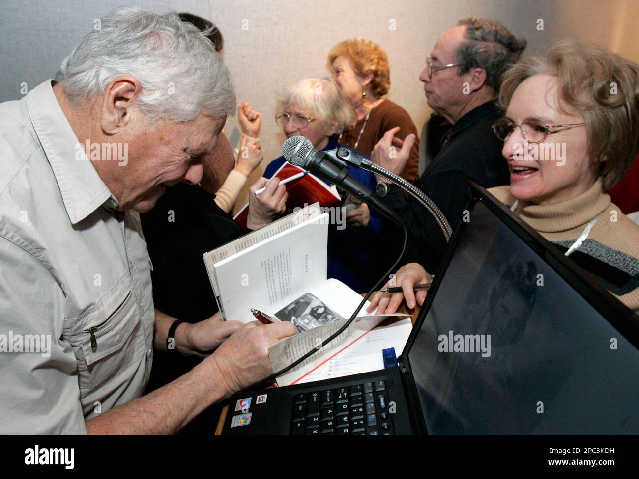 George Brady, older brother of Hana of the play "Hana's Suitcase" signs ...