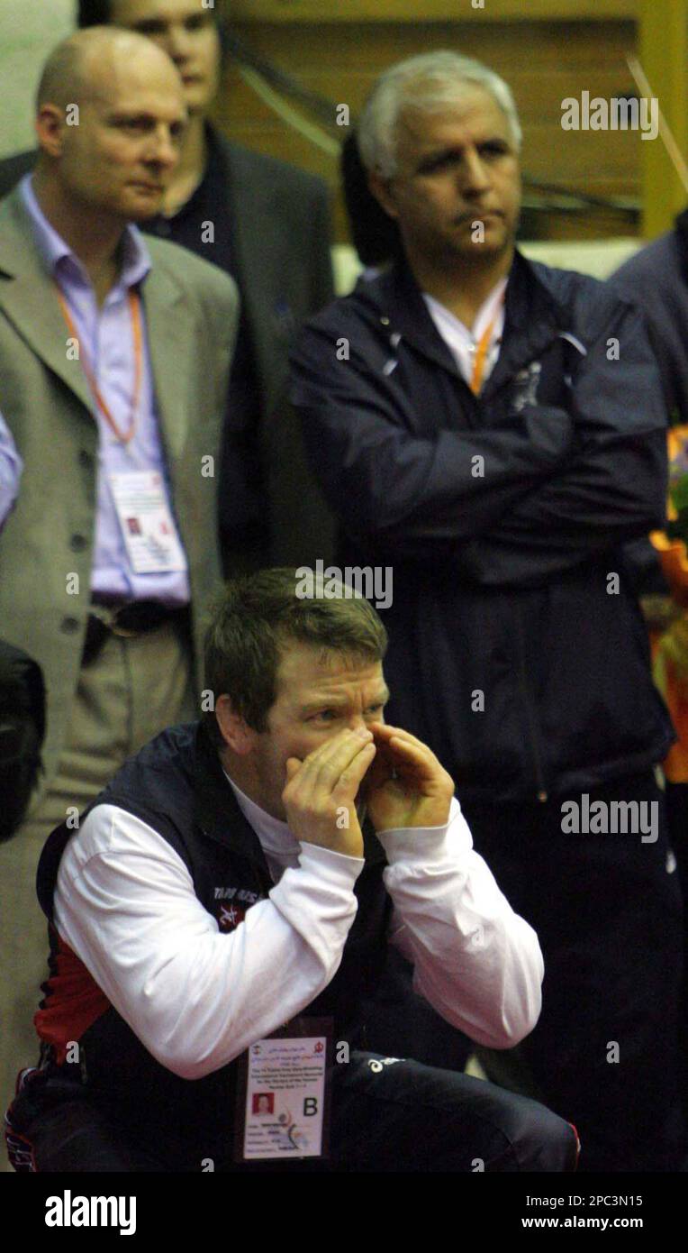 U.S. coach Terry Brands shouts as he coaches U.S. freestyle wrestler ...