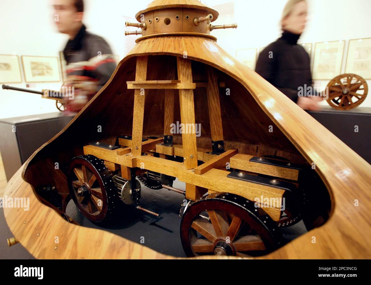 Visitors look at a scale model of a tank during "Leonardo da Vinci ...