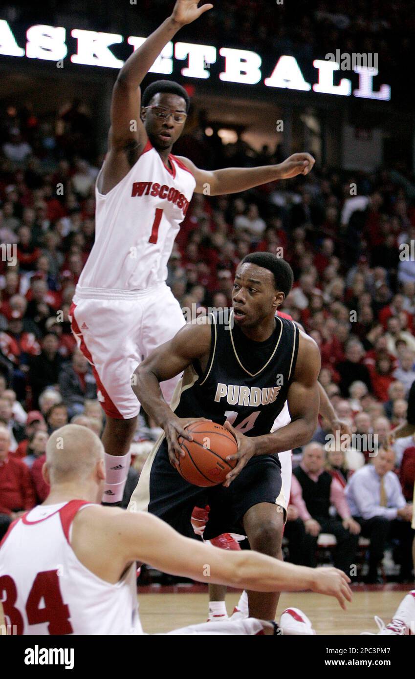 Purdue's Carl Landry (14) looks to maneuver around his brother ...