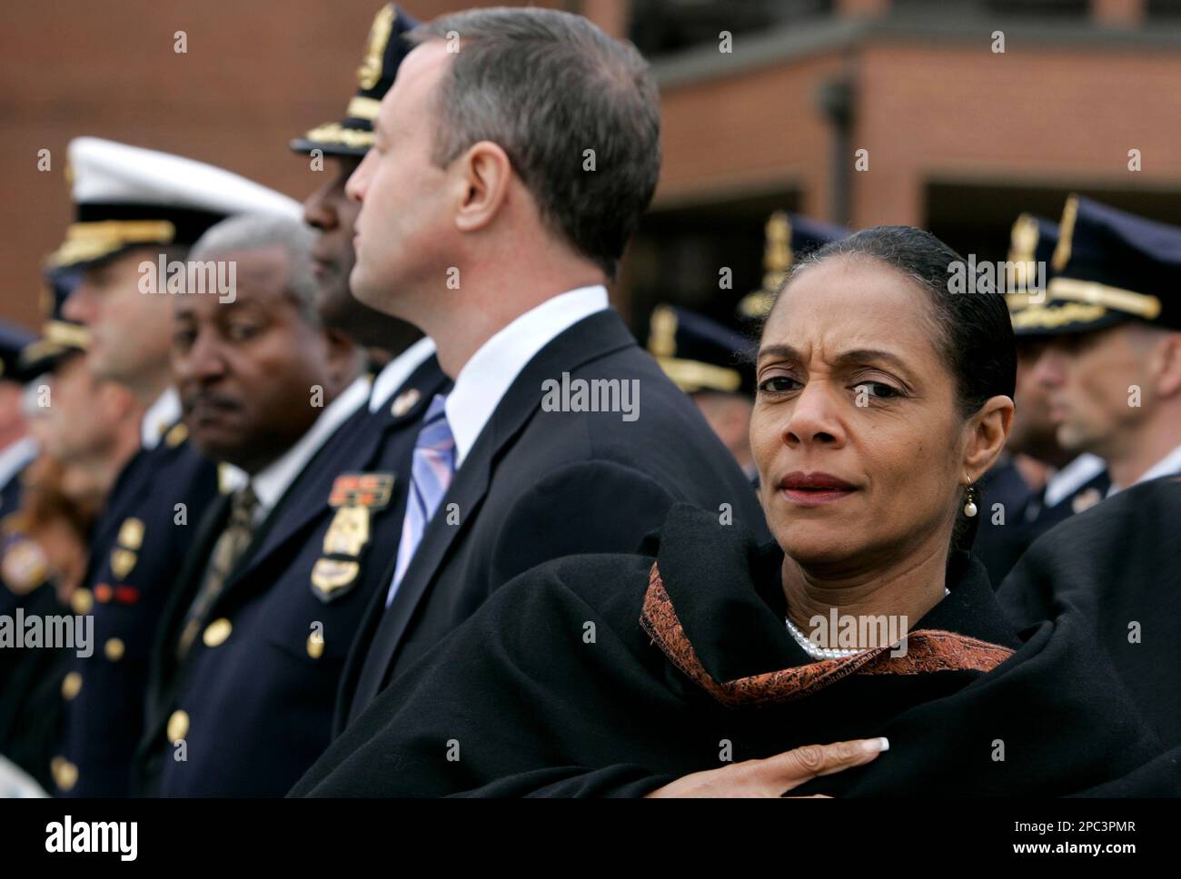 Baltimore Mayor Sheila Dixon, right, stands in an honor line during the ...