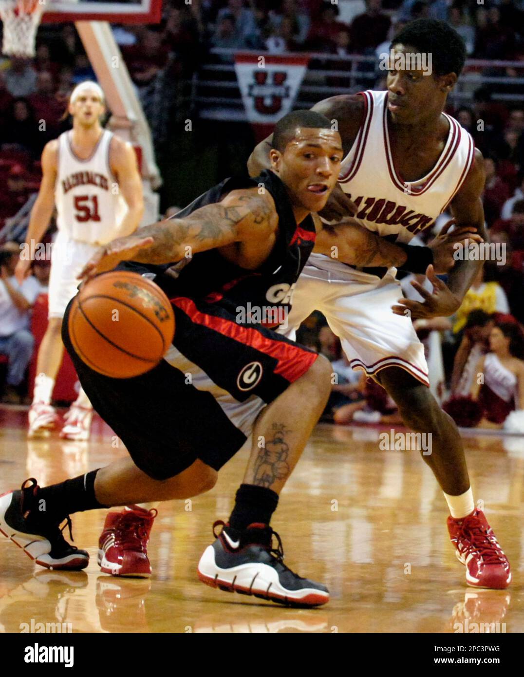 Georgia's Billy Humphrey, left, reaches back for the ball after it was ...