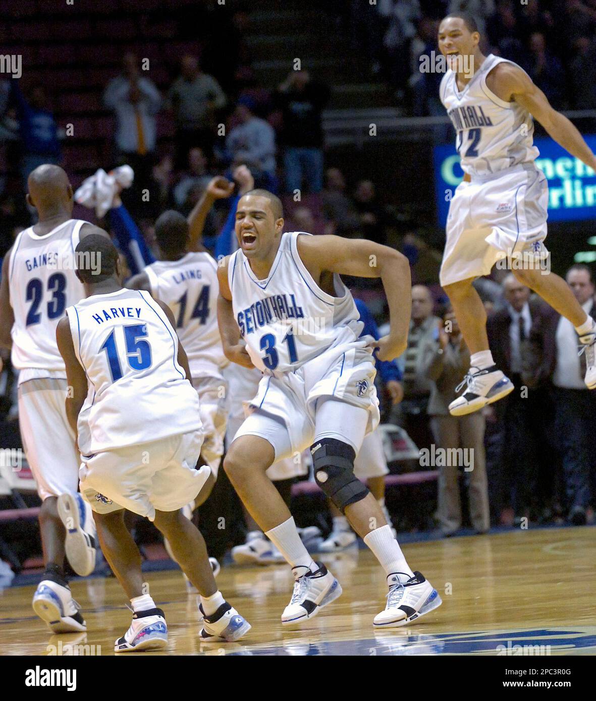 Seton Hall's Eugene Harvey (15), John Garcia (31) and Paul Gause, right ...