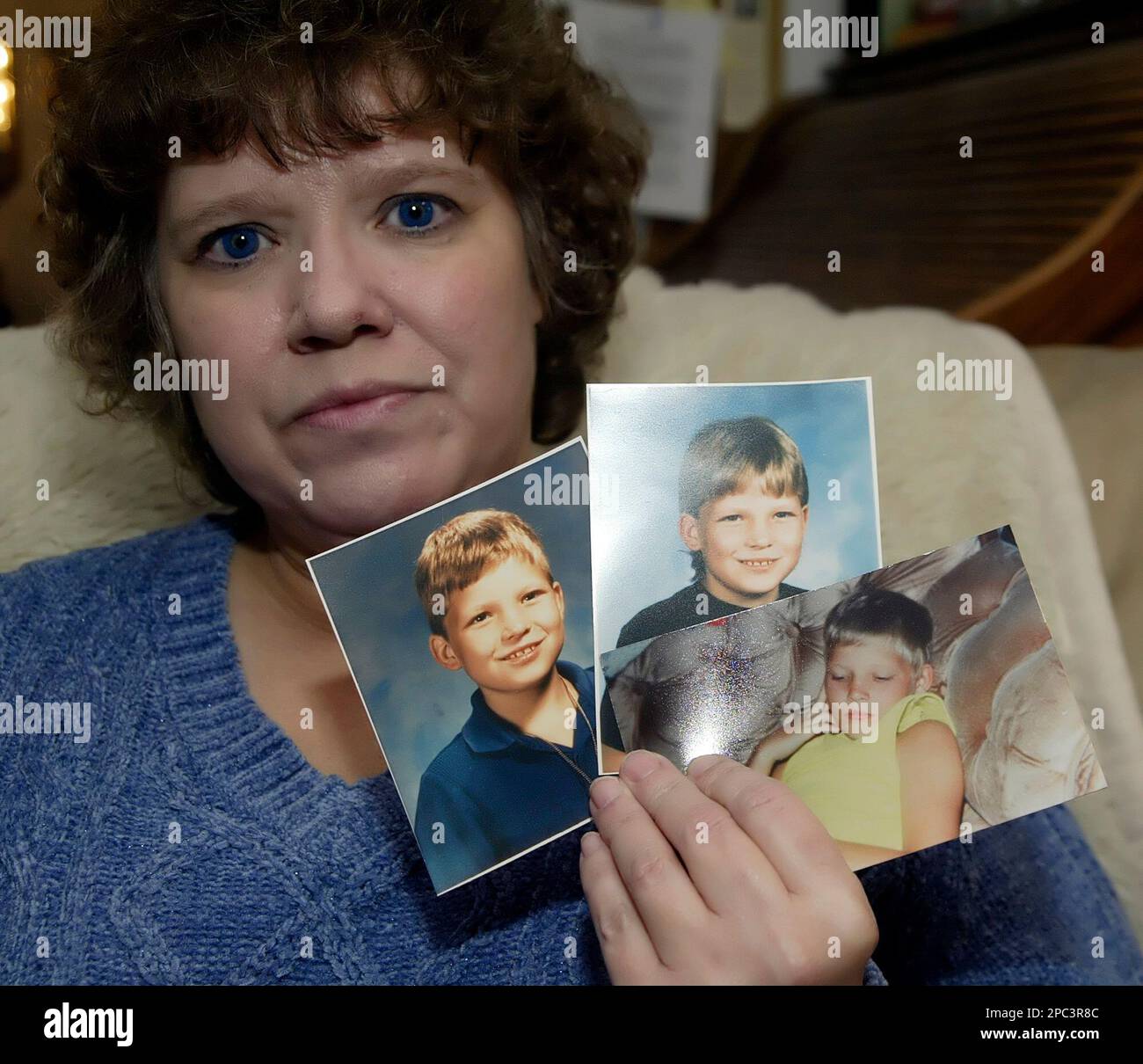 Debbie Henderson, mother of missing boy Charles Arlin Henderson, holdS ...