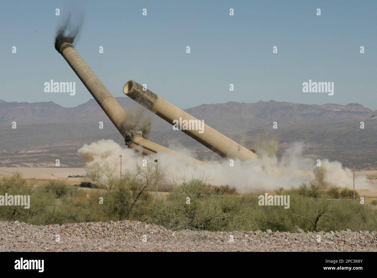 The smelter stacks at the former Magma Copper complex fall during ...
