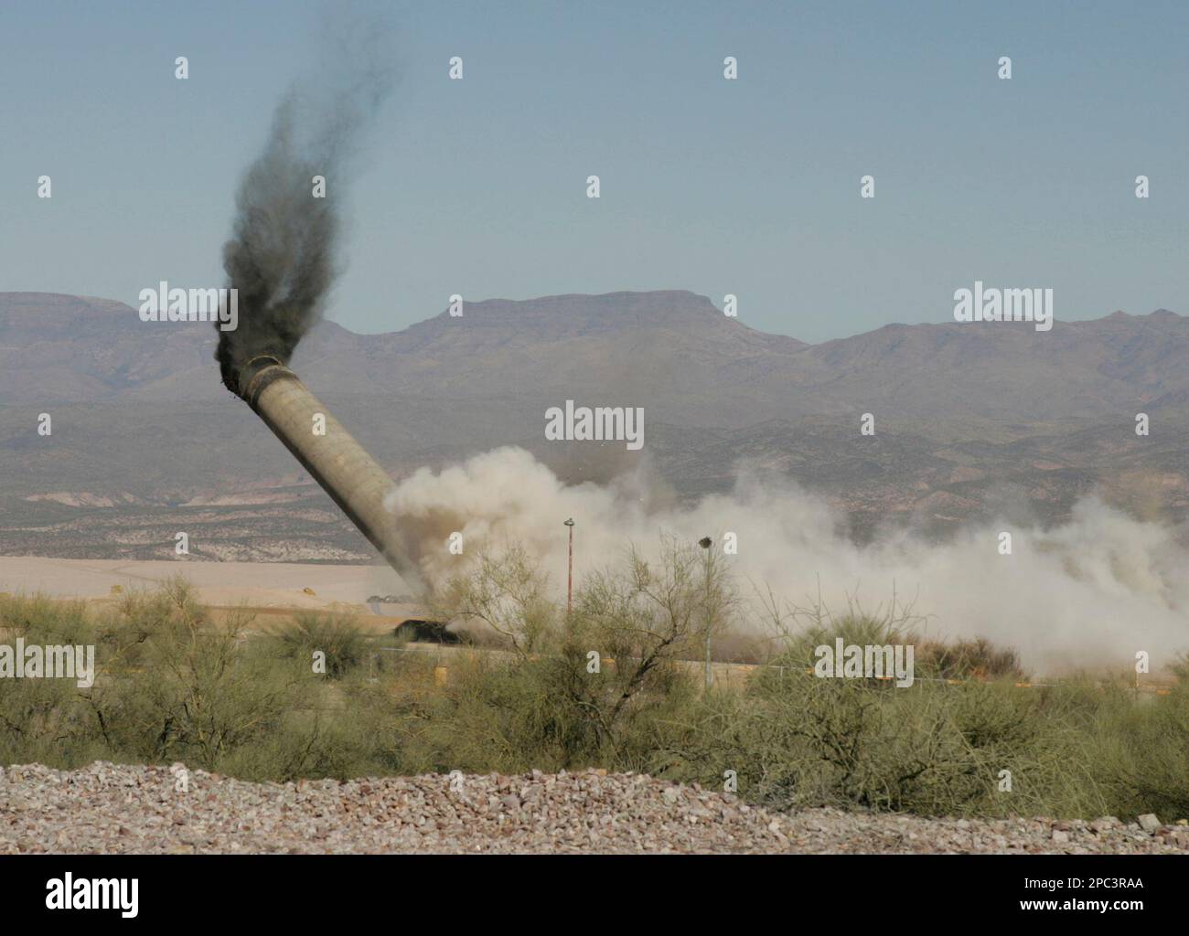 The smelter stacks at the former Magma Copper complex fall during ...