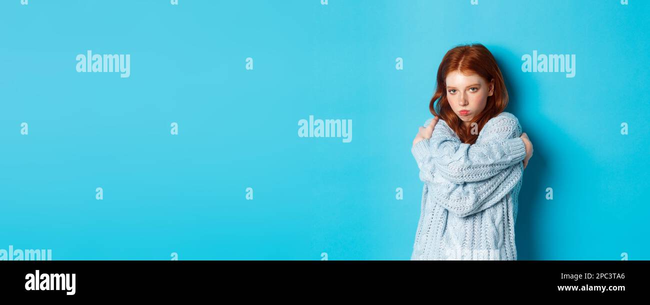 Silly and cute redhead girl pucker lips and looking offended ...