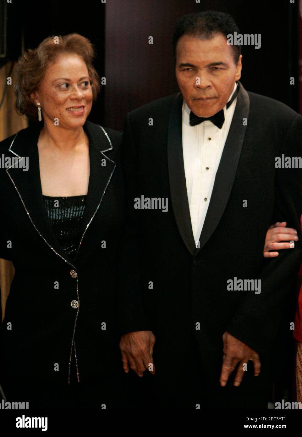 ** FILE ** Muhammad Ali poses for photographs with his wife Yolanda ...