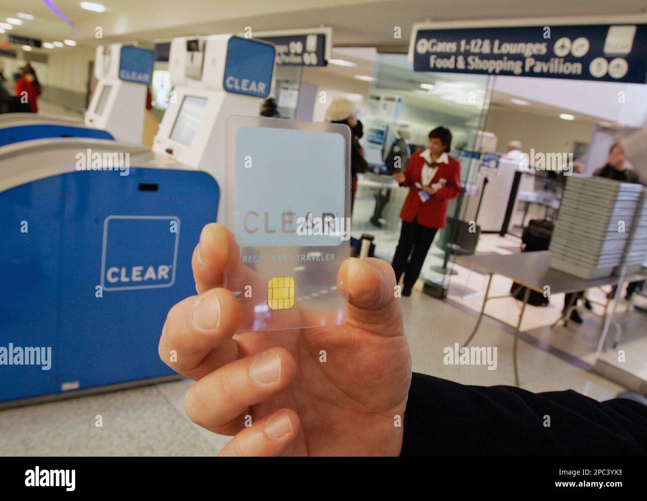A Clear biometric identification card is displayed at a TSA checkpoint ...