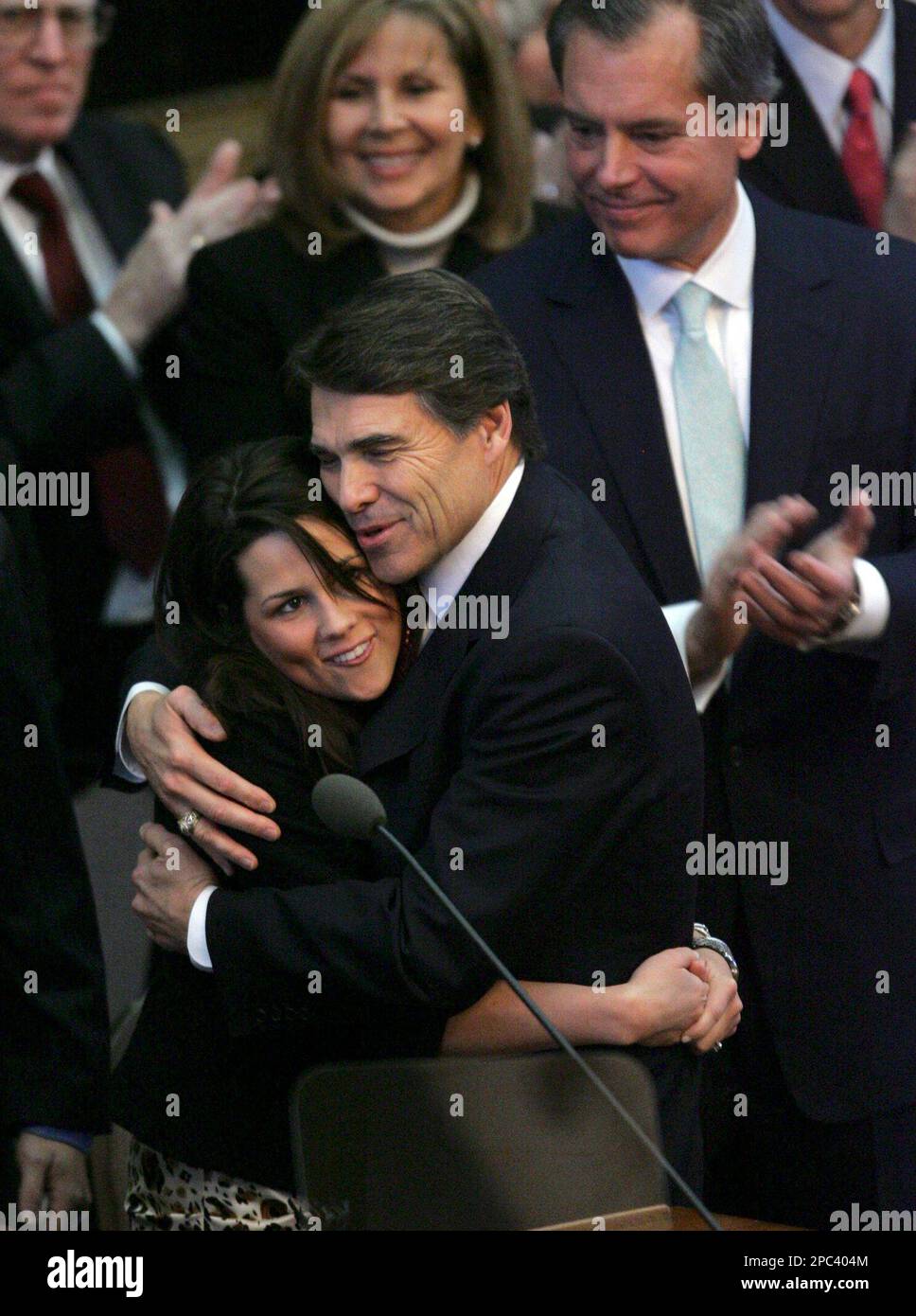 Texas Gov. Rick Perry, right, hugs his daughter Sydney Perry after ...
