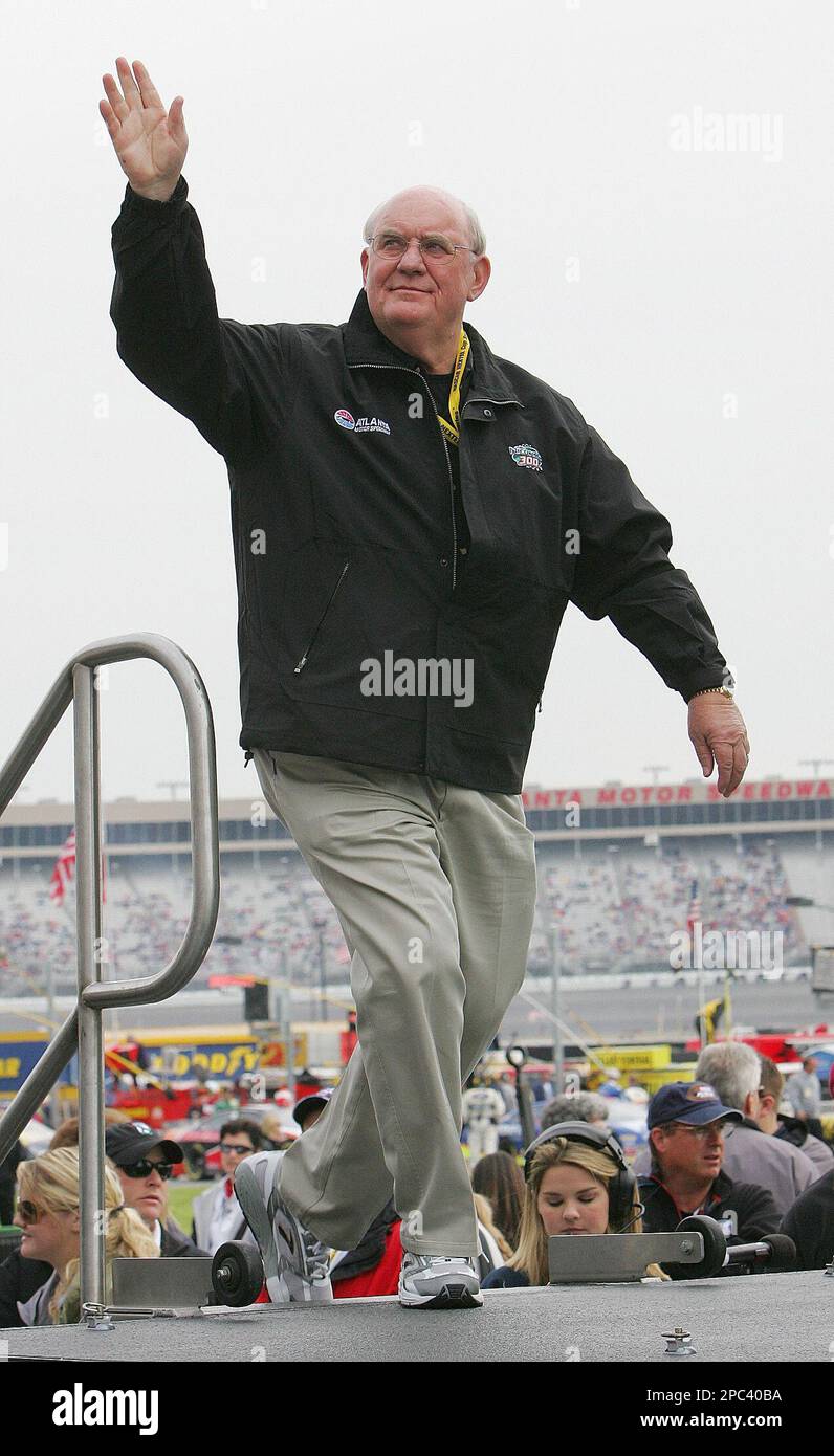 ** FILE ** NASCAR legend Benny Parsons waves to the fans as he is ...
