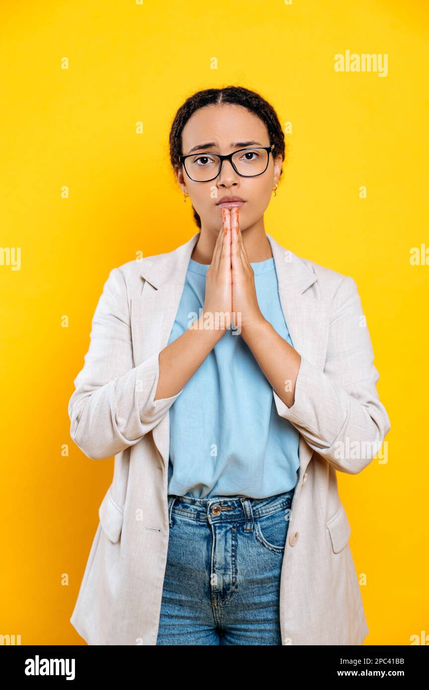 Asking for something, praying. Vertical photo of pleading cute mixed ...