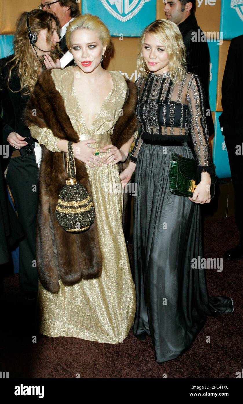 Mary-Kate Olsen, left, and her sister Ashley arrive for the In Style ...