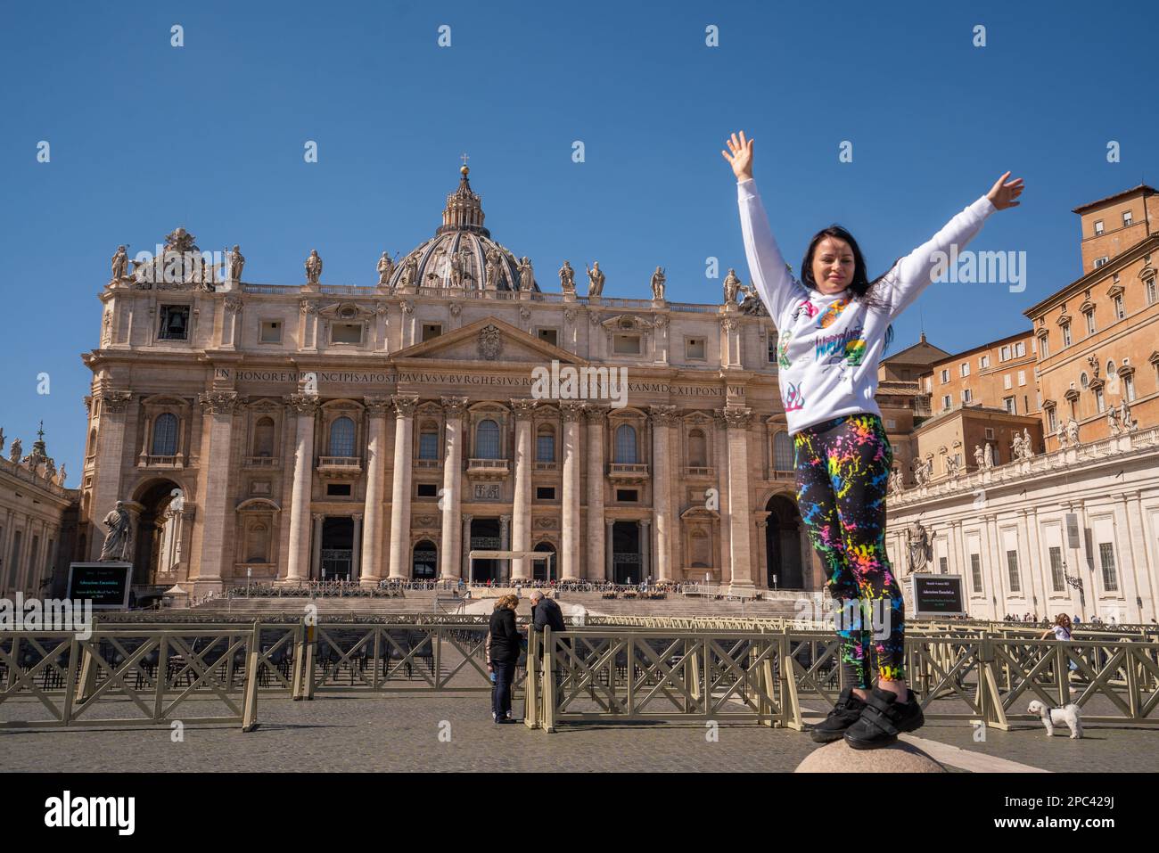 Rome, Italy. 1 3March 2023. A tourist poses with arms outstretched in ...