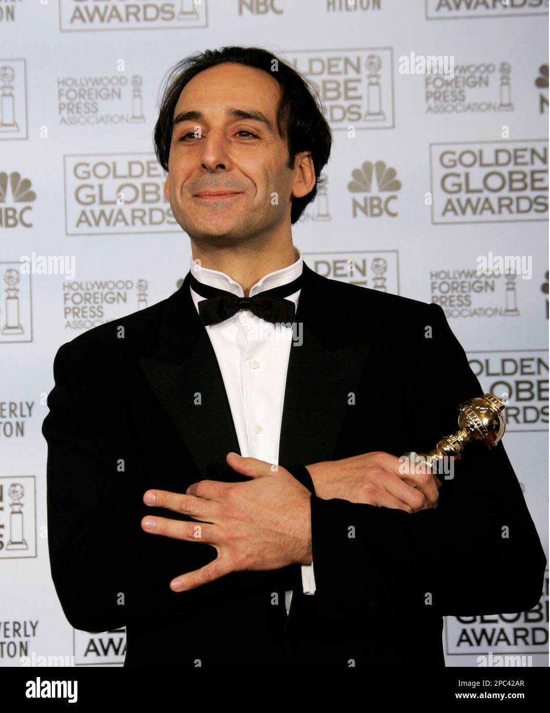 Composer Alexandre Desplat poses with the award for best original score ...