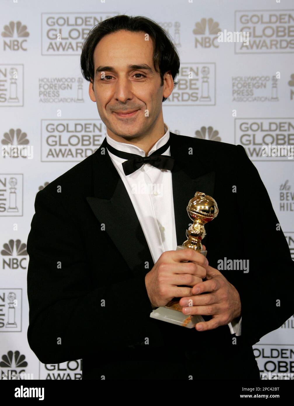 Composer Alexandre Desplat poses with the award for best original score ...