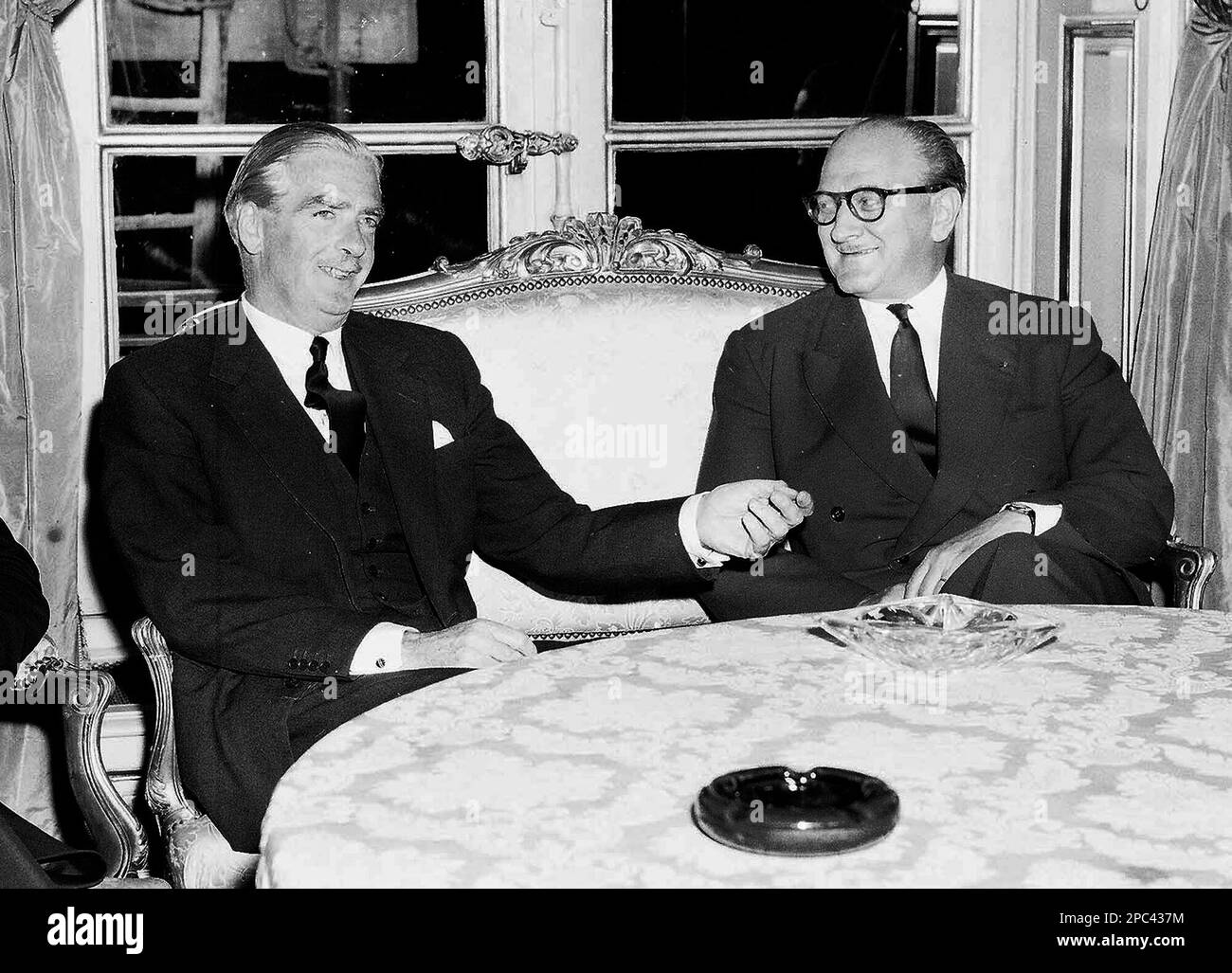 ** FILE** British Prime Minister Sir Anthony Eden, left, sits with ...