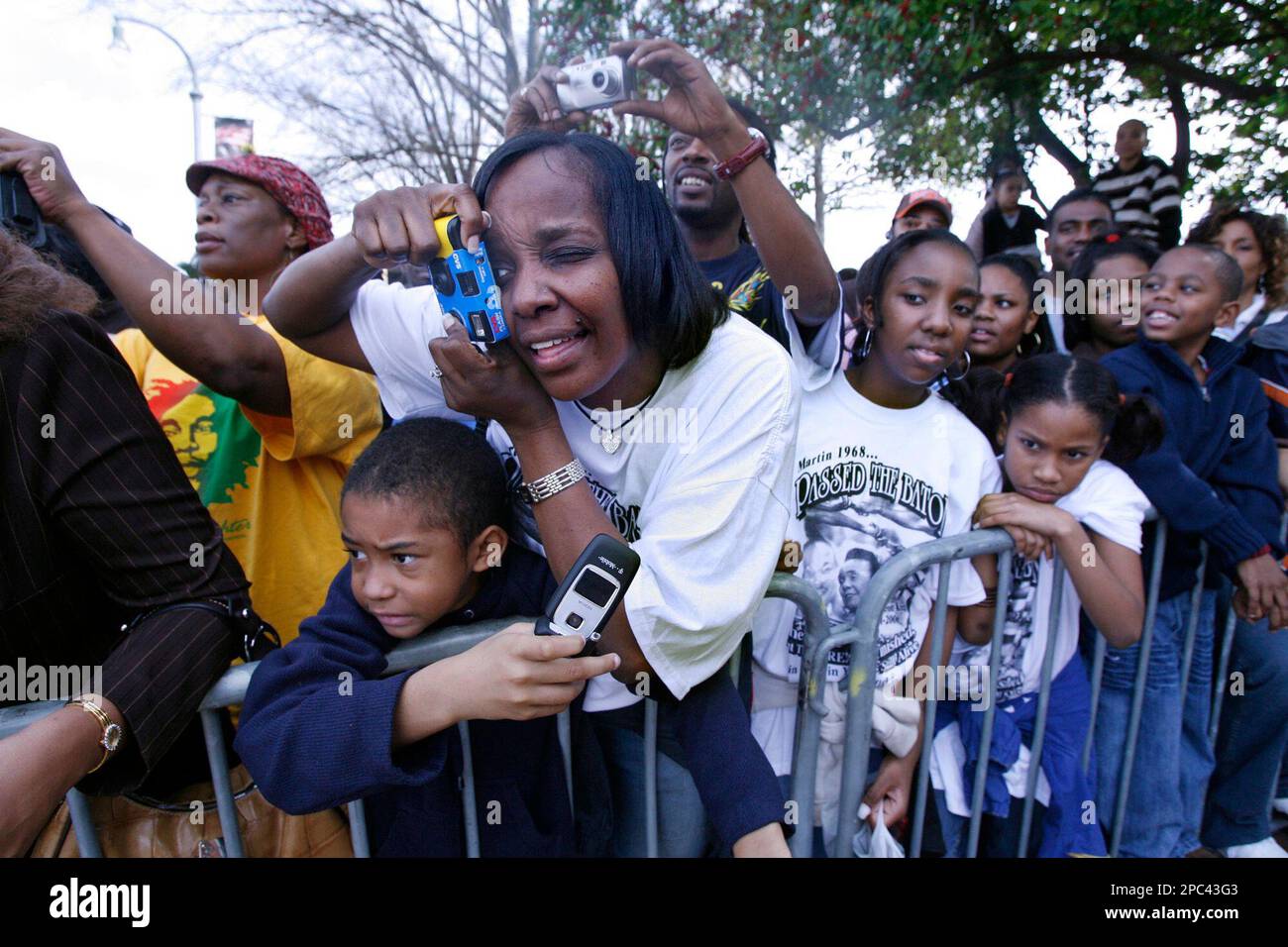Ramona Hull, of Greenville, Miss., leans over Cameron Howell, 6, in ...