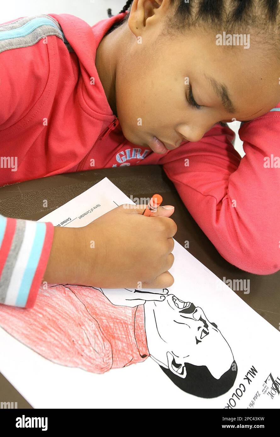 Shaesha Willliams, 8, colors a picture of Martin Luther King Jr. during ...