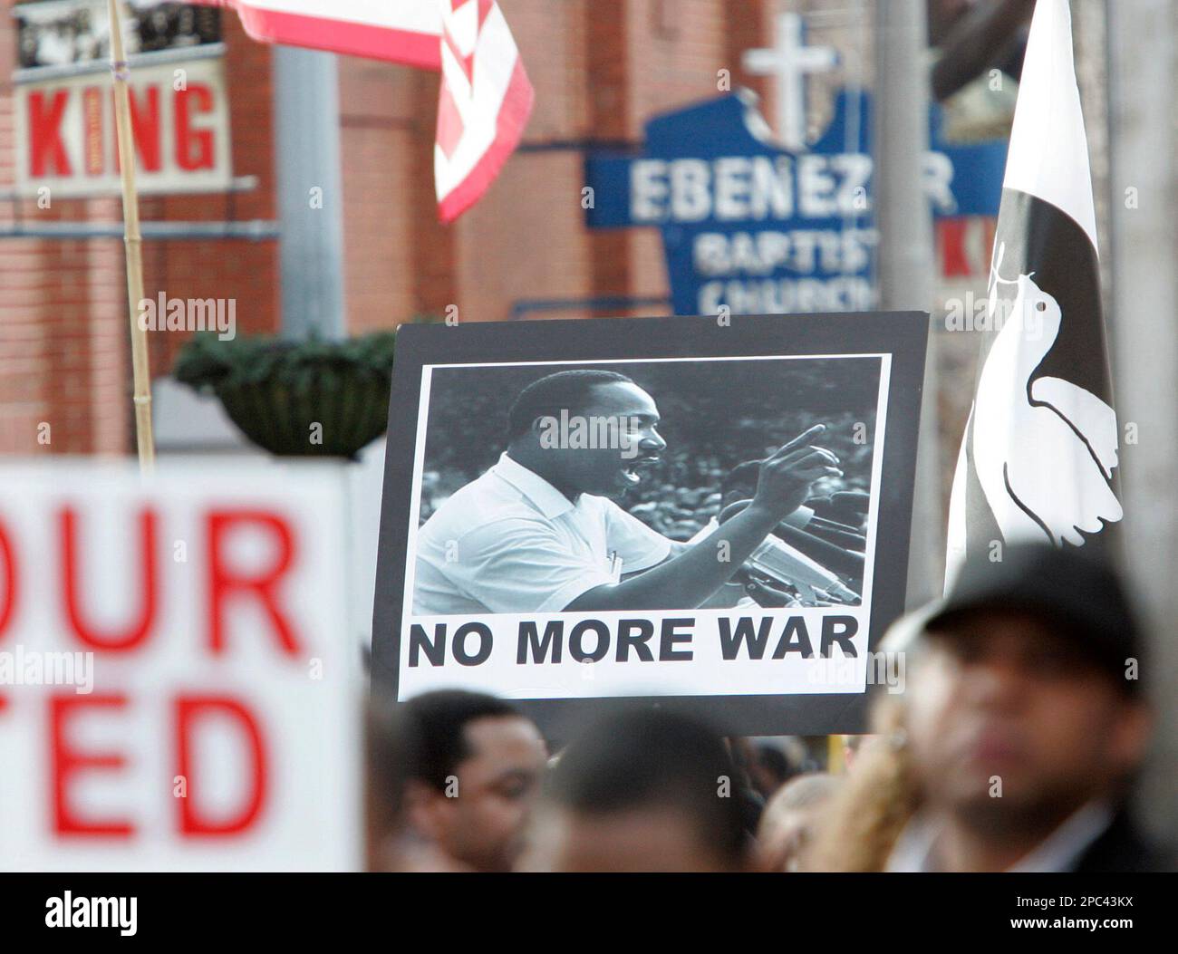 Supporters of Dr. Martin Luther King, Jr., hold signs harkening back to ...