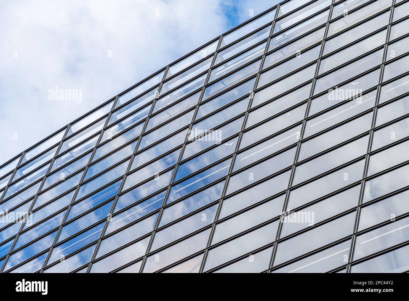 The wall of glass windows of a building Stock Photo - Alamy