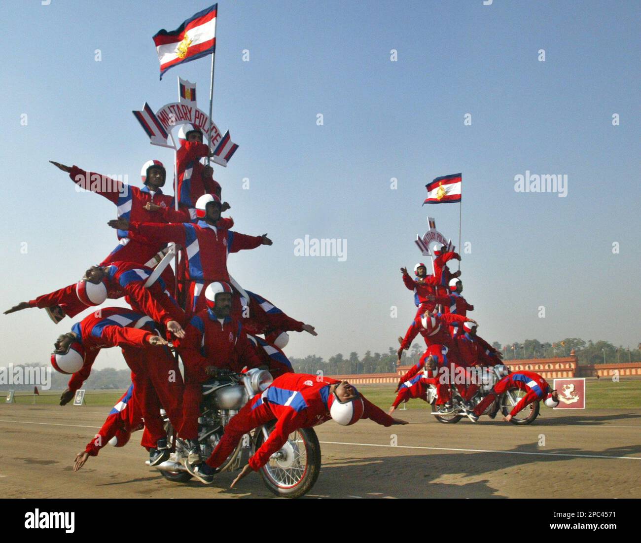 An Indian Army soldiers perform acrobatic skills on motorcycles during ...