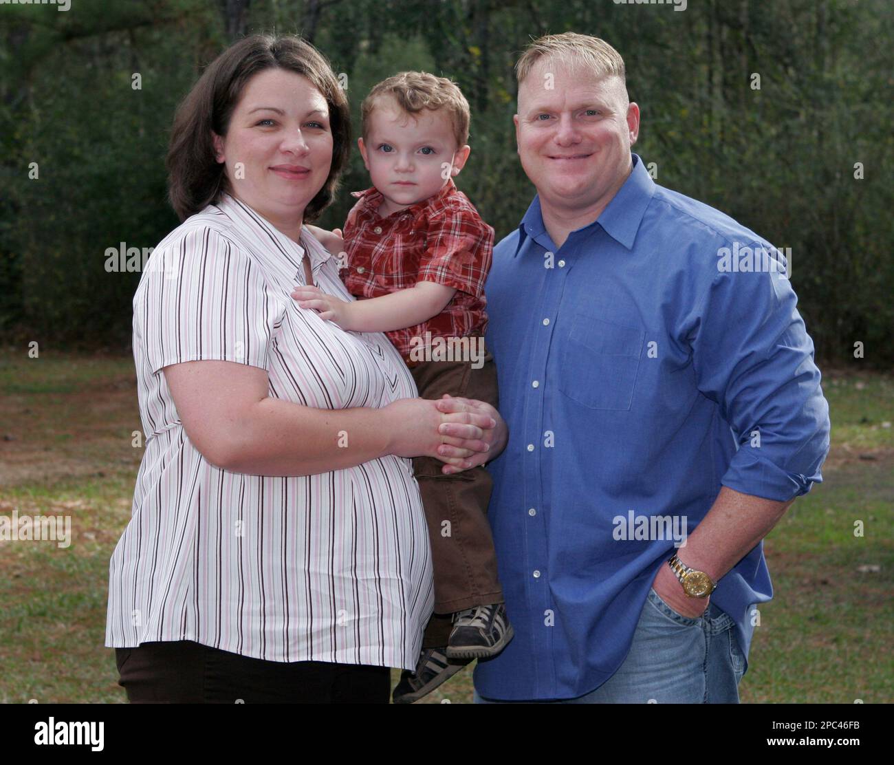Rebekah Markham, and her husband Glen Markham, pose for a photograph ...