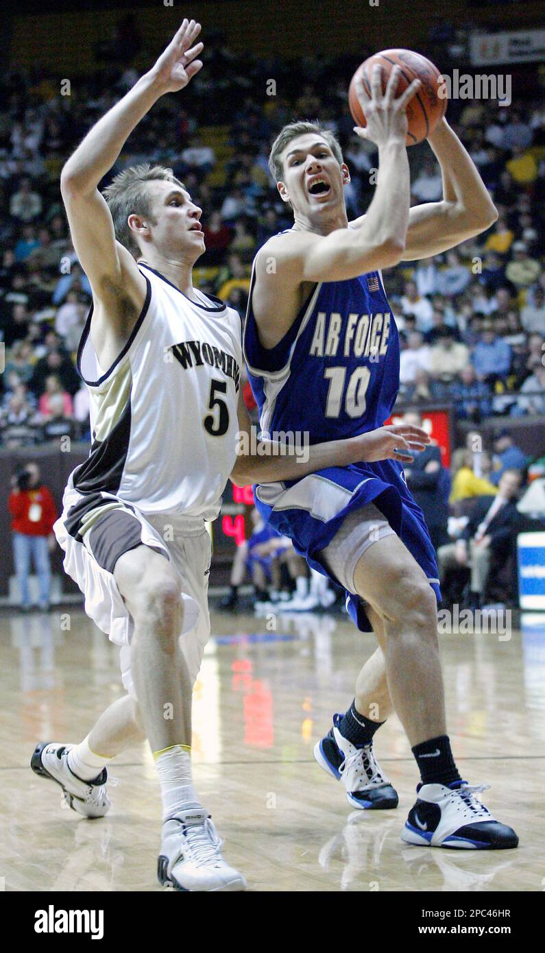 Air Force's Andrew Henke (10) drives past Wyoming's Ryan Dermody during ...
