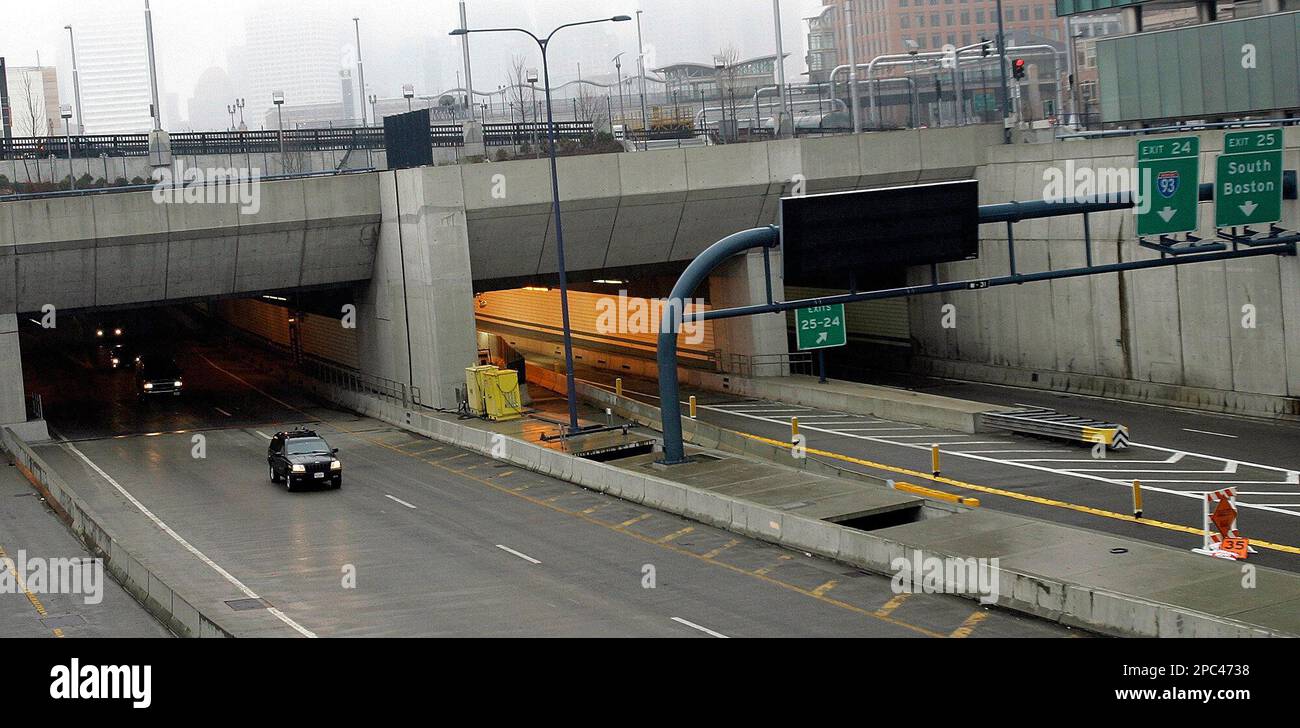 Cars, left, drive through the eastbound lanes of the Interstate 90 ...