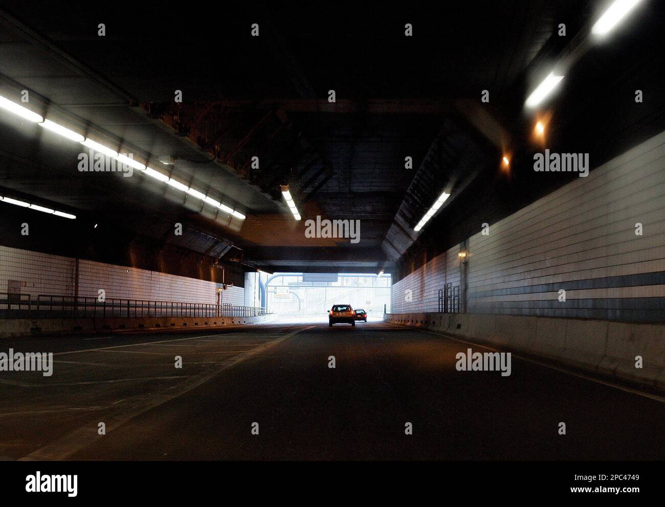 Cars drive through the eastbound lanes of the Interstate 90 connector ...