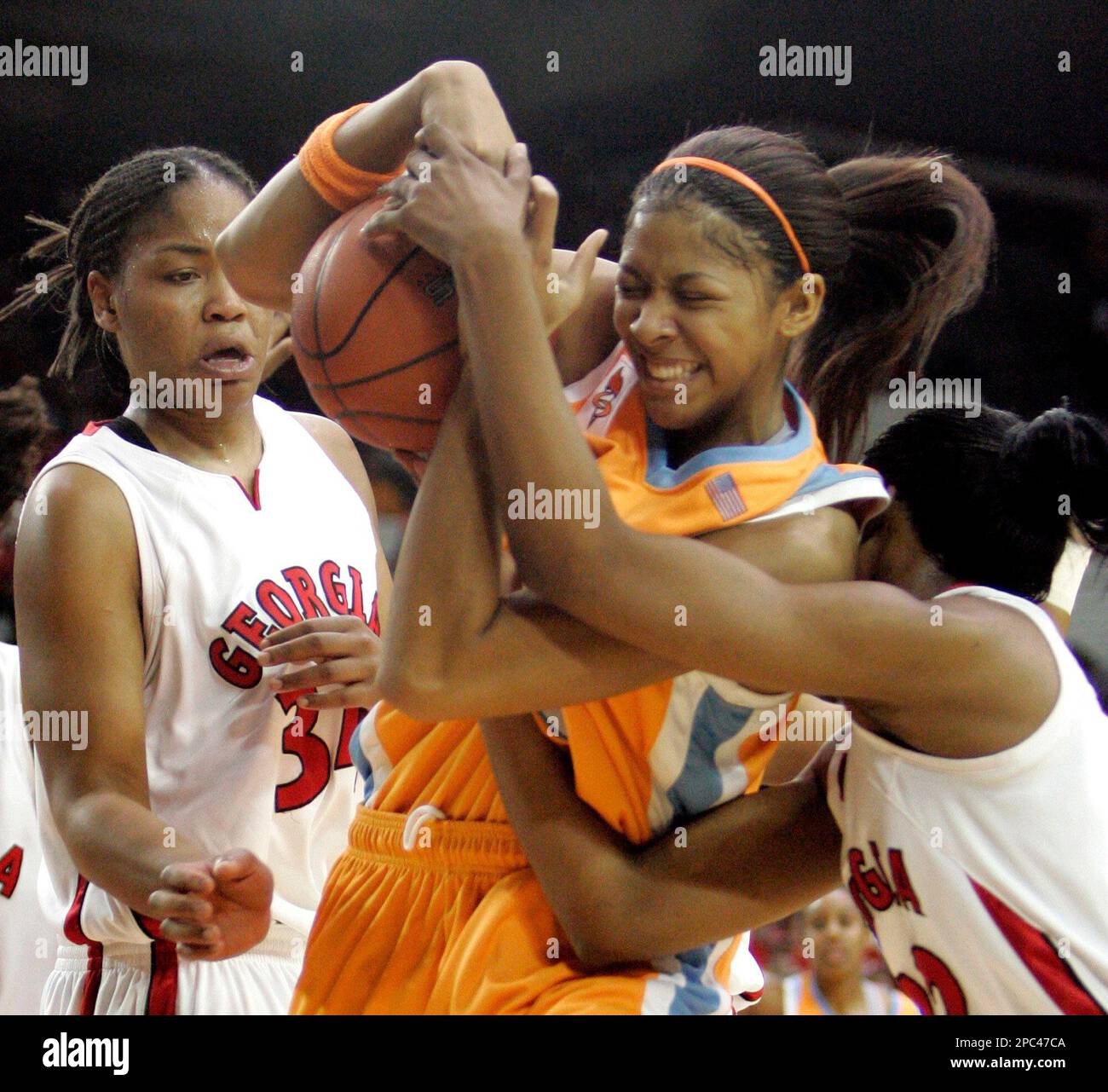 Tennessee's Candace Parker, center, is tied up by Georgia's Christy ...