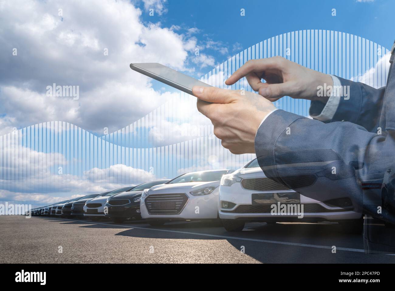 Hands with digital tablet on a background of rows of cars. Car sales ...