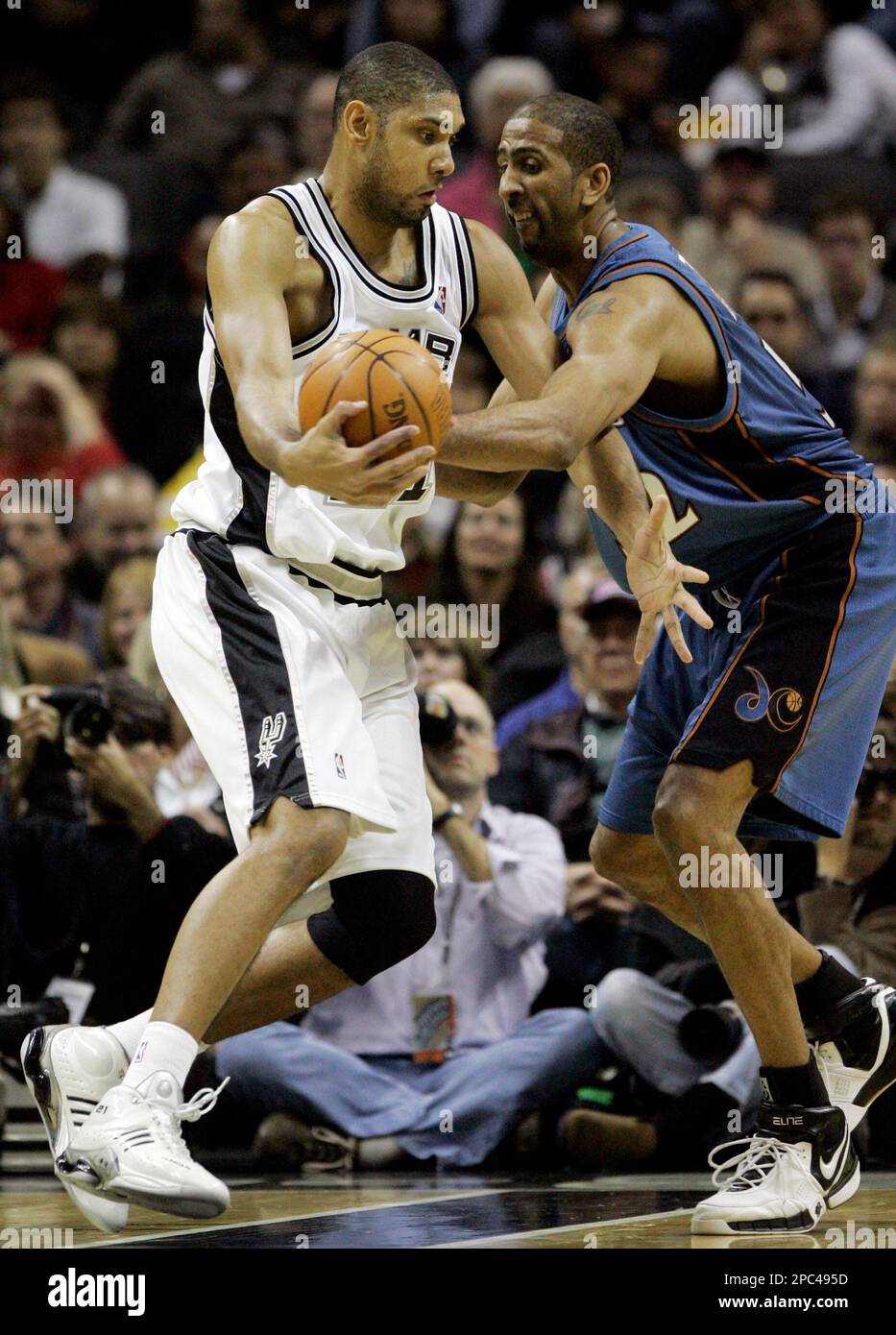 San Antonio Spurs forward Tim Duncan is pressured by Washington Wizards ...